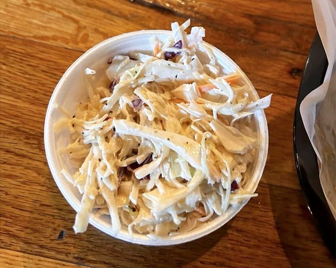 Coleslaw that knows its purpose in life: to cut through rich barbecue with crisp, tangy perfection. Not just a side—it's an essential companion.