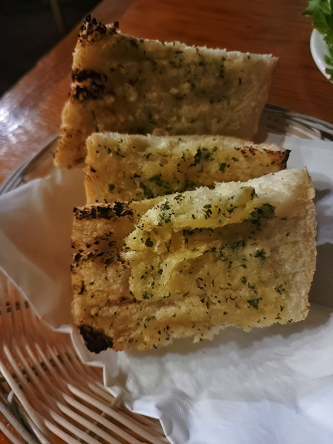 Garlic bread that doesn't whisper its presence—it announces itself with buttery, herbaceous authority. Social distancing from vampires has never been more delicious.