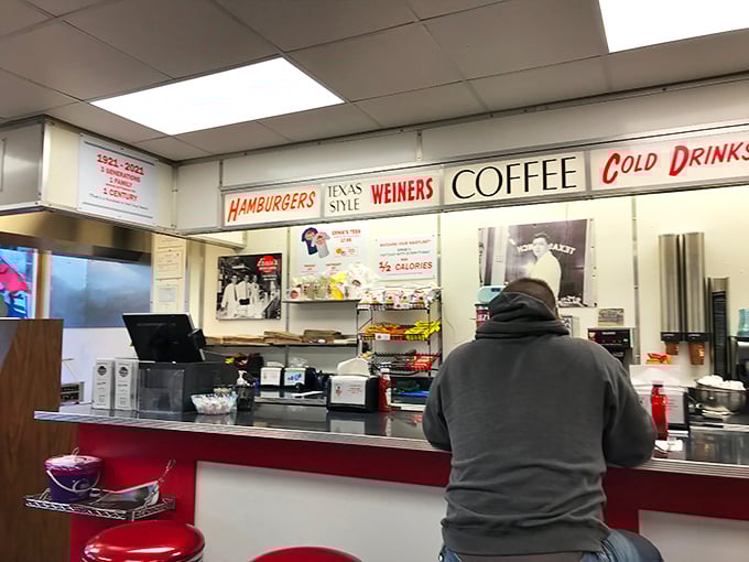 Where "WEINERS" and "COFFEE" share equal billing on the marquee, a reminder that in America's diners, all comfort foods deserve spotlight.