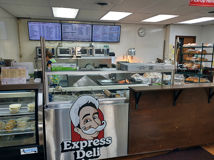 The counter—where sandwich dreams become reality. That mustachioed logo isn't just cute; it's a mark of quality that locals have trusted for decades.