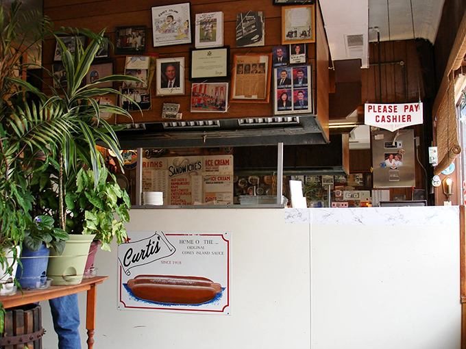 Behind this counter, culinary magic happens with the kind of care that chain restaurants forgot long ago.