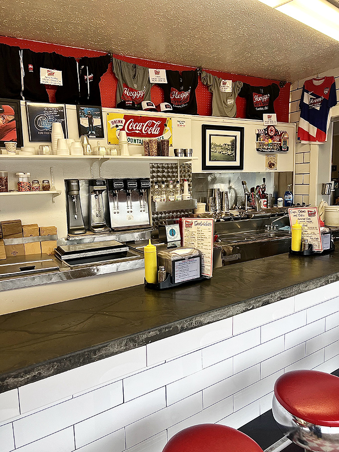 The soda fountain counter—where magic happens with simple ingredients and practiced hands. Norman Rockwell would approve of this scene.