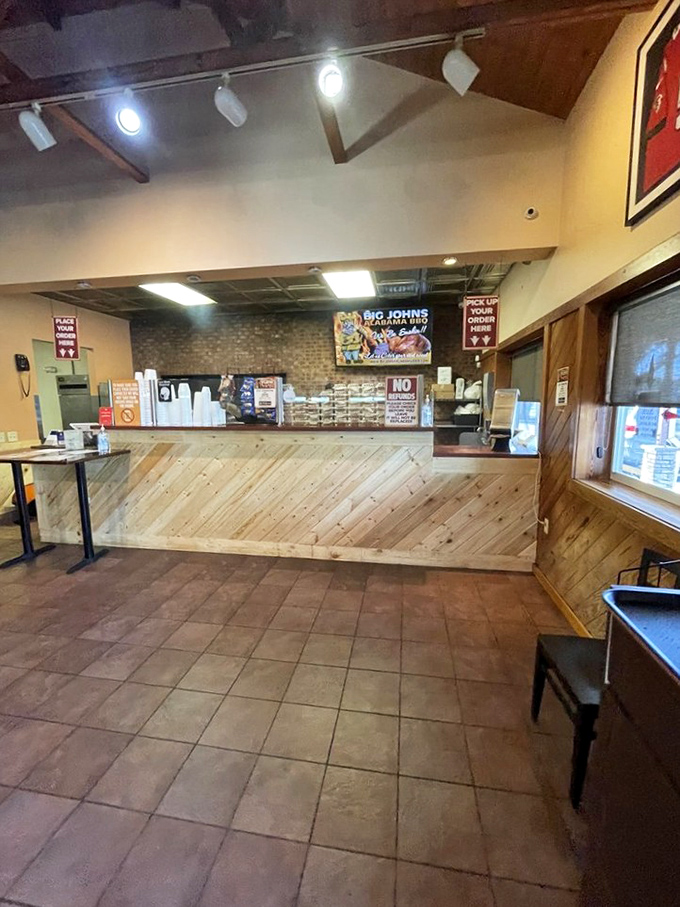 The ordering counter—where dreams are placed and smoky realities are born. Wood paneling that's witnessed thousands of "mmm" moments. 
