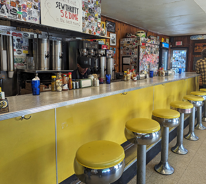 The yellow counter with chrome stools isn't just functional—it's a front-row seat to the greatest show in Atlanta: breakfast.