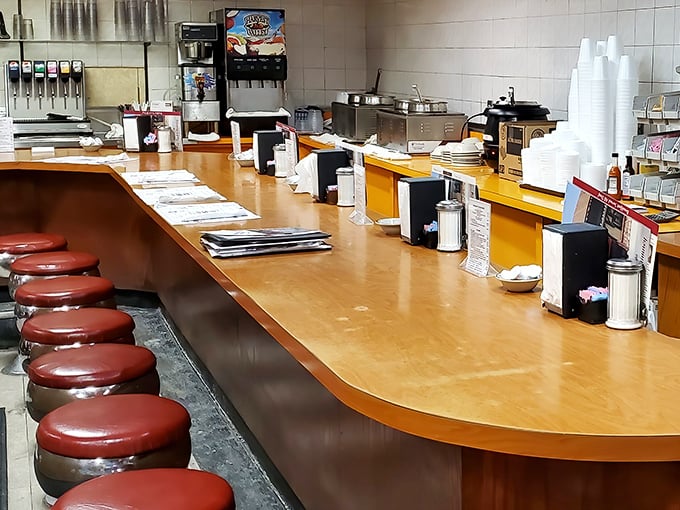 The counter—where solo diners find community, regulars find their usual spots, and everyone finds that perfect vantage point for people-watching.