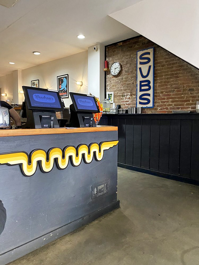 The counter's distinctive yellow wave design isn't just decorative—it's a warning sign that flavor tsunamis are regularly assembled here.