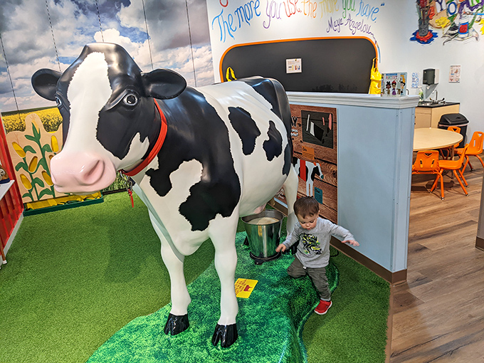This life-sized cow isn't just decoration—it's entertainment for the little ones whose patience for mommy's "just one more store" has long since evaporated.