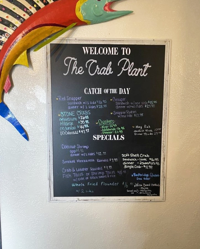 The daily specials board—a treasure map where X marks the spot for coconut shrimp, fish tacos, and whatever the Gulf decided to share today.