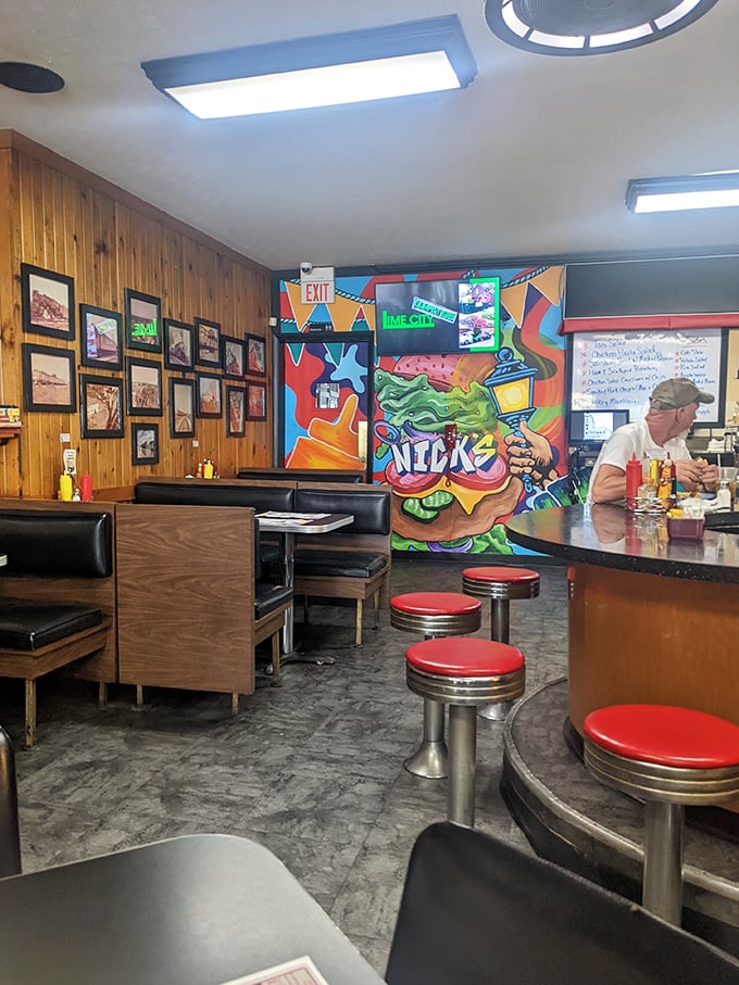Vintage photographs line the wood-paneled walls, telling Huntington's story while a vibrant mural brings modern energy to this historic space.