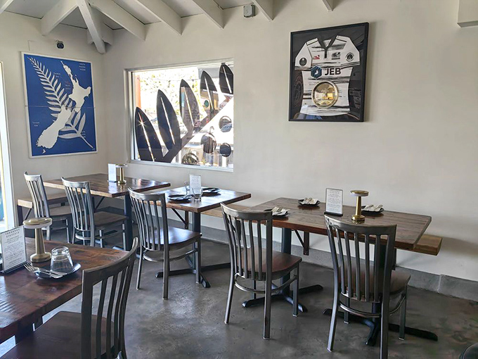 Clean lines, nautical touches, and those surfboards visible through the window – California coastal dining without trying too hard.