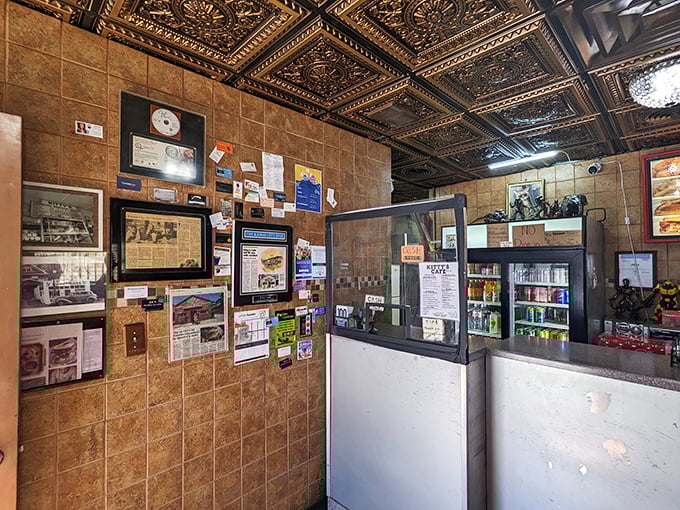 The wall of memories at Kitty's tells stories of seven decades serving Kansas City. Every framed article and photo represents thousands of satisfied customers.