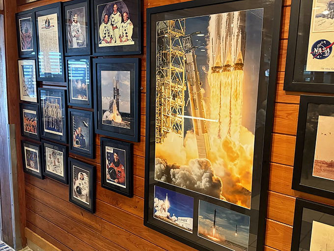 The wall of space memorabilia reminds you that you're in Titusville—where rocket scientists and astronauts come for rock shrimp after a day of literal rocket science.