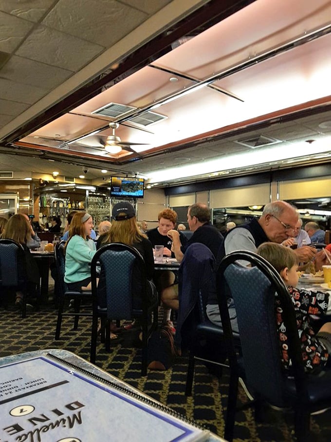 The bustling dining room hums with the symphony of clinking forks, coffee refills, and conversations – the soundtrack of American diner culture playing in real-time.