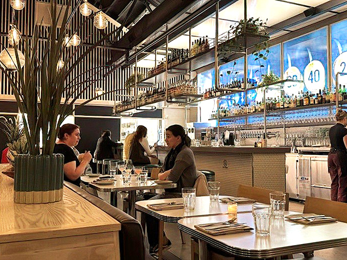 The dining room hums with the universal language of satisfaction—forks pausing mid-air as diners savor that perfect bite.