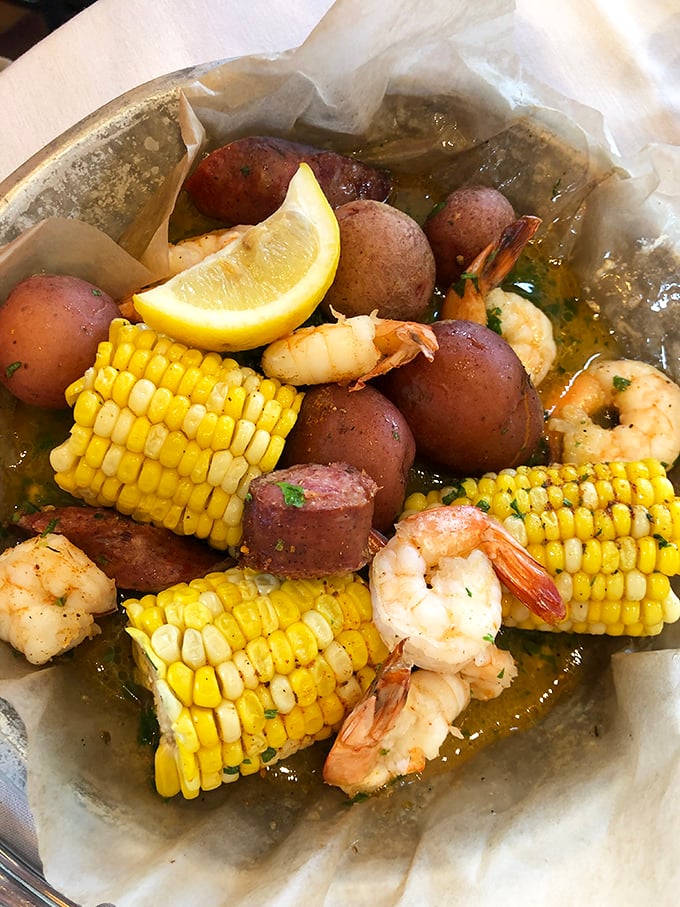 A seafood boil that's part feast, part treasure hunt. Finding those plump shrimp among the potatoes and corn is adult hide-and-seek.