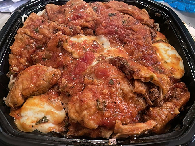 Italian-American comfort in takeout form. This chicken parmesan doesn't just satisfy hunger – it creates food memories that linger for days.