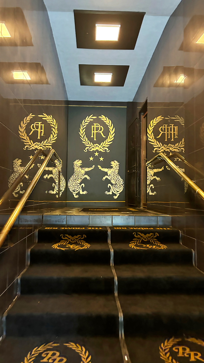 Gold leopards guard the entrance like this is Fort Knox for flavor. The stairway to heaven, if heaven were made of prime beef.