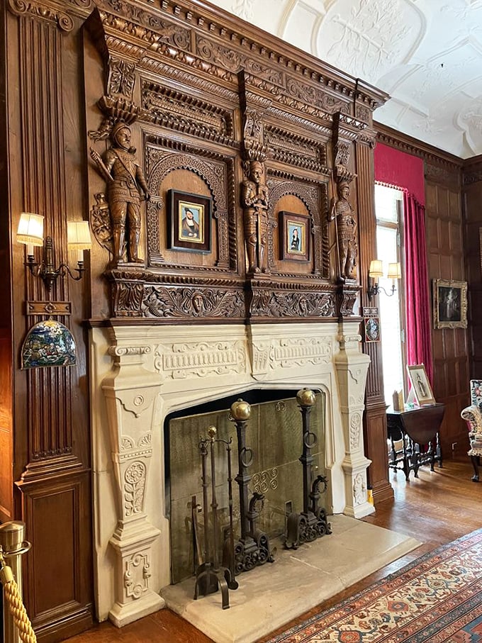 A fireplace that doesn't just warm a room—it announces it. Carved figures stand eternal guard over the hearth.