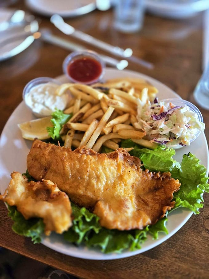 Fish and chips that would make a British pub regular weep with joy—golden, crisp, and impossibly fresh.