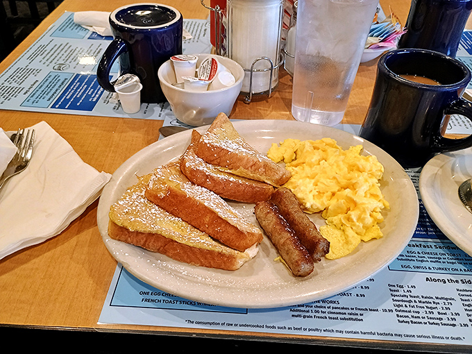 French toast that's been soaking up custard since dawn, dusted with powdered sugar and served with a side of morning happiness.