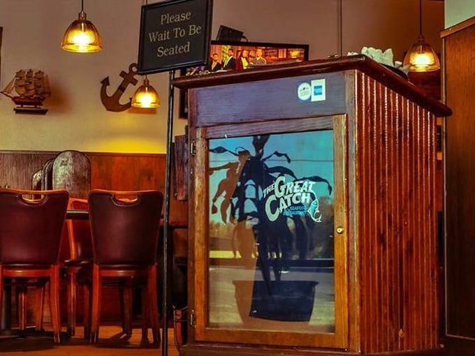 "Please Wait To Be Seated" reads the sign, but the lobster logo practically whispers, "Trust us, the wait is worth it."