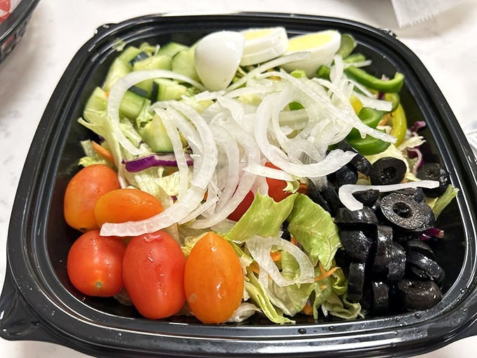 A garden salad for those maintaining the illusion of balance. "Yes, I had vegetables with my cheesesteak" becomes technically true.