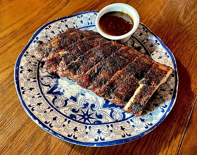 Ribs with a smoke ring so perfect it could be framed. The sauce cup is just a formality—these beauties stand gloriously on their own.