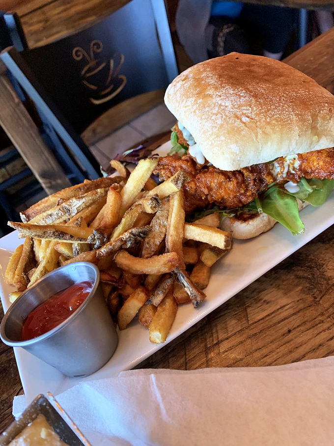 A sandwich that requires both hands and possibly a nap afterward. Those fries aren't just sides—they're supporting actors deserving of their own spin-off.