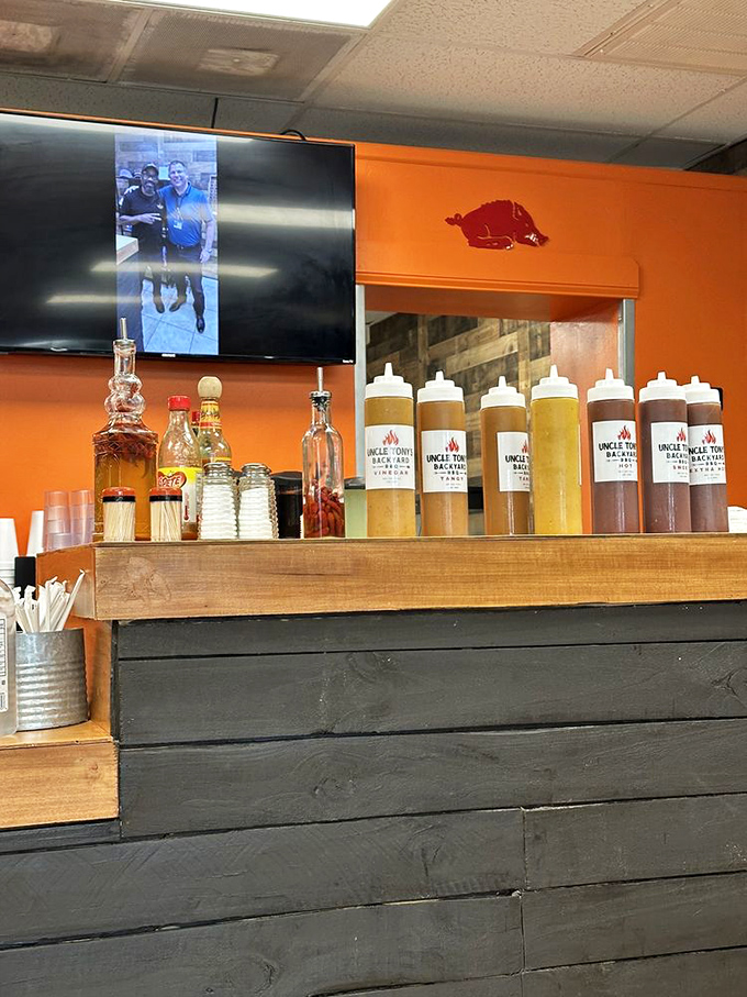 The sauce lineup—liquid gold in squeeze bottles—where your BBQ journey takes its final, crucial flavor direction.