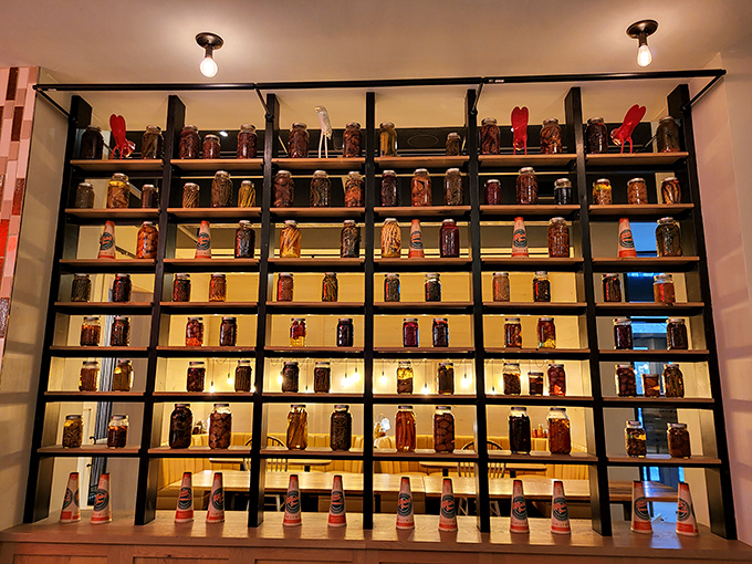 The wall of preserves stands like a library of flavor—each jar a story of Pennsylvania's seasonal bounty captured in glass.