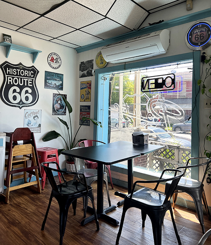 Sunlight streams through blue-trimmed windows, highlighting Route 66 memorabilia that takes you on a road trip without leaving Pennsylvania.
