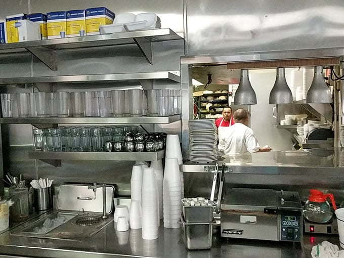 The kitchen—where morning magic happens with military efficiency. These aren't just cooks; they're breakfast commandos executing perfect egg missions.