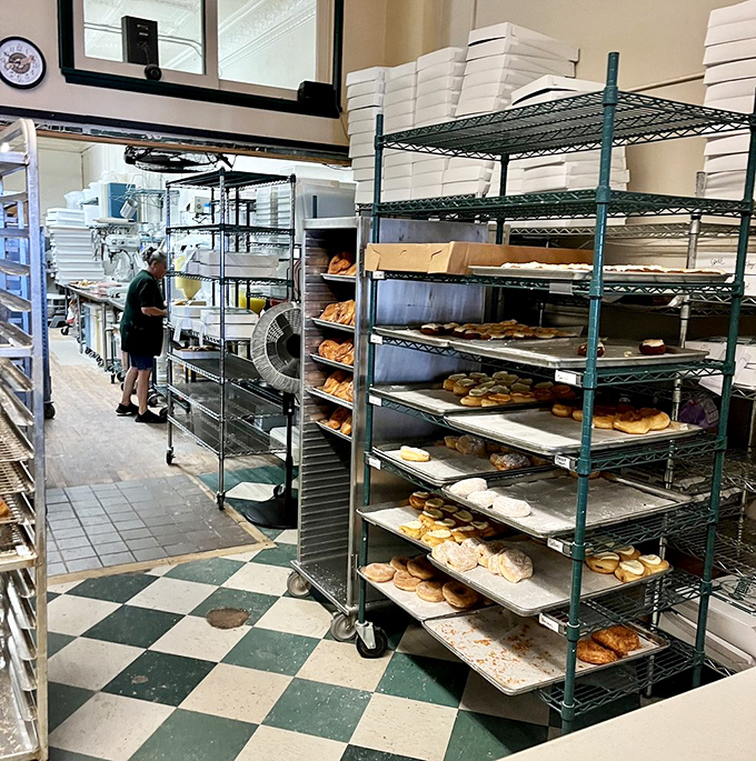 Behind the scenes where donut magic happens. Those racks aren't just holding pastries—they're cradling dreams.