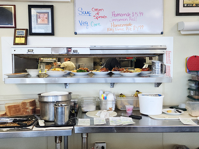 Behind every great diner is a kitchen that means business. The pass-through window offers glimpses of breakfast magic in the making.