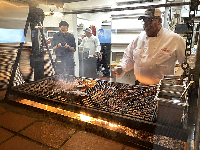 The magic happens here – where fire meets meat in the ancient dance of Santa Maria-style barbecue. The chef's focused expression says everything about their dedication.