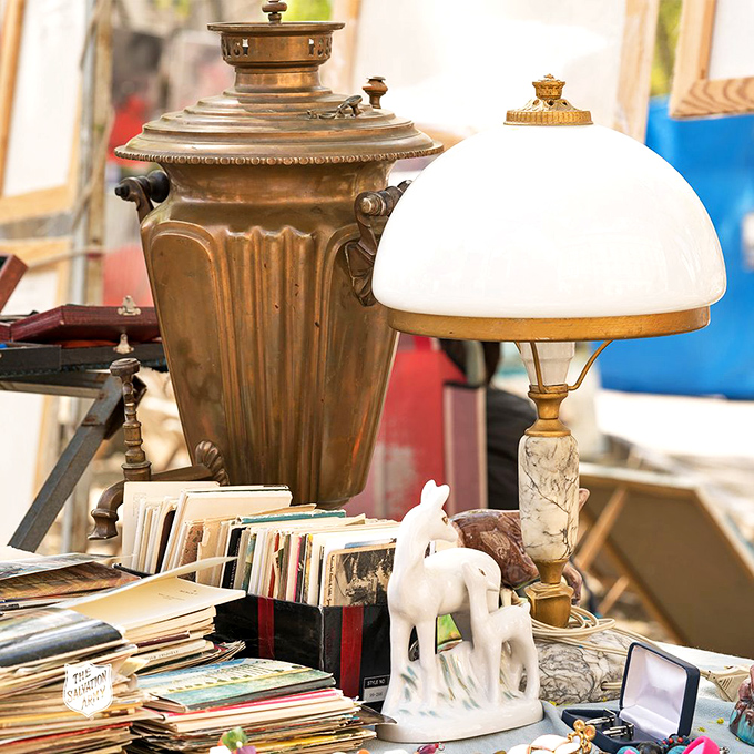 Vintage lighting and collectibles create a time-travel corner where mid-century meets modern budgets with illuminating results.