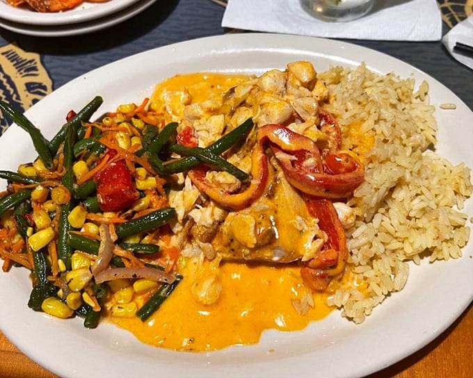 A colorful plate that brings together seafood, vegetables, and rice in perfect harmony—like a delicious beach vacation for your taste buds.