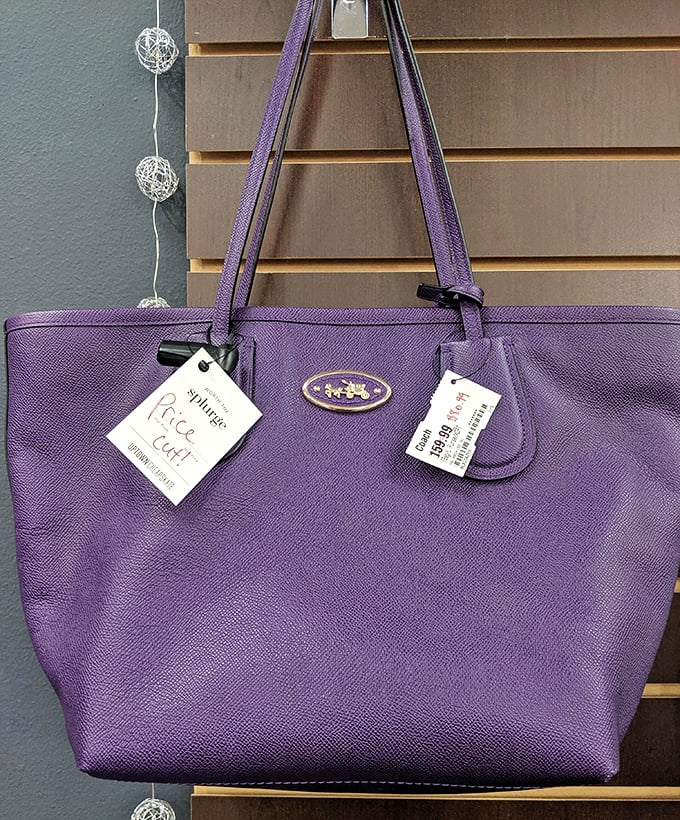 This purple Coach tote still flaunts its tags—proof that someone's shopping regret becomes your fashion triumph.