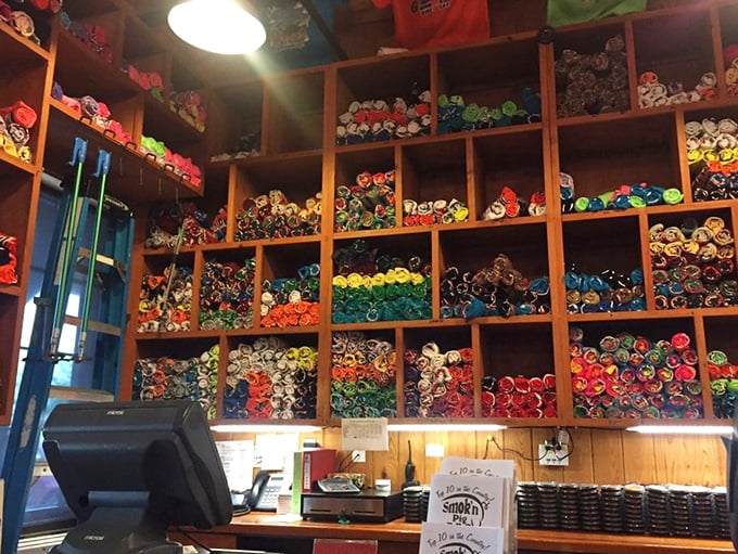 "Keep Calm and Pig On"—words to live by in a world of colorful t-shirts. The merchandise wall is a rainbow of BBQ devotion.