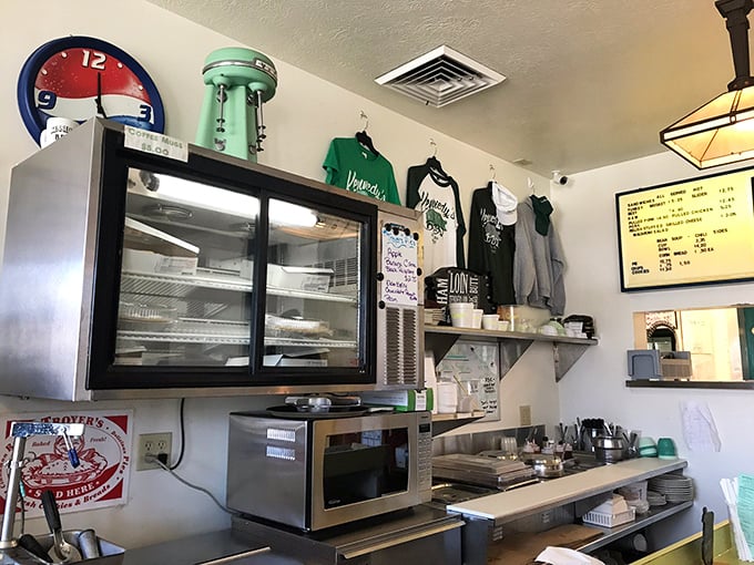 The merchandise wall says what regulars already know: you'll want to take a piece of this experience home with you, even if it's just a t-shirt.