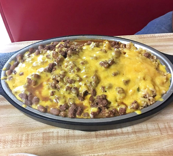 This isn't just cheese and beef having a party – it's a full-blown Texas fiesta on a plate that's worth every napkin you'll need.