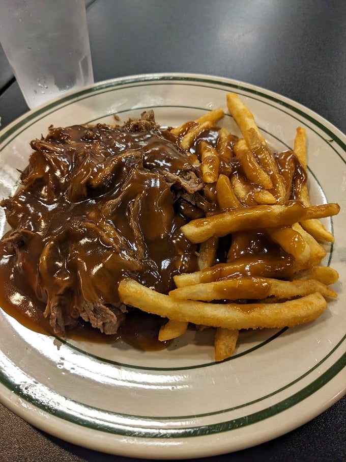 This open-faced roast beef sandwich swimming in rich gravy isn't just comfort food – it's a warm hug on a plate.