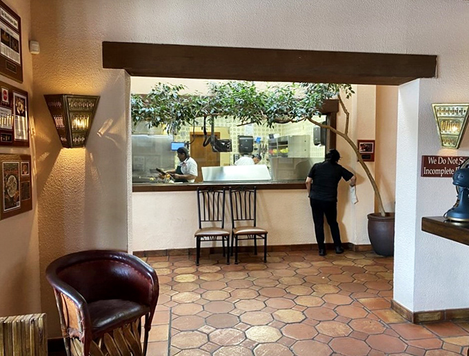 A glimpse into the ordering window – where culinary magic begins its journey from kitchen to your eagerly waiting taste buds.