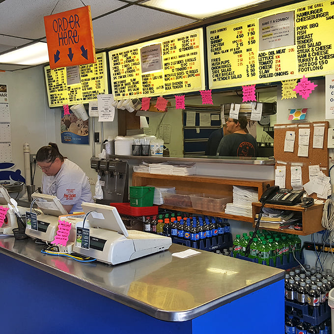 Where the magic happens—order counters with menu boards unchanged by passing food trends. Some traditions are perfect exactly as they are.