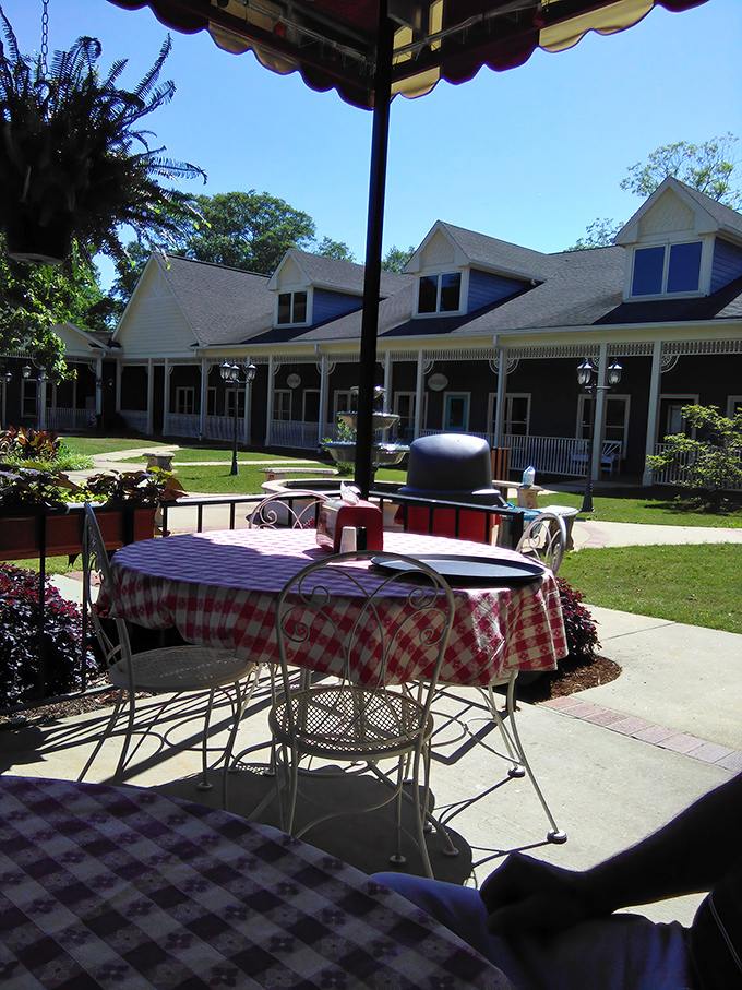 Outdoor dining with checkered tablecloths and Southern charm—where the breeze carries conversations and the occasional whiff of fresh pie.
