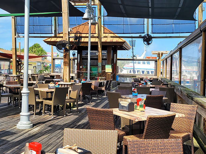 Rusty's outdoor seating area – where the gentle harbor breeze serves as nature's air conditioning and boats provide the entertainment.