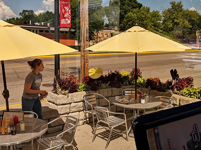 Outdoor dining with yellow umbrellas that match the sunshine in your scrambled eggs. Wisconsin summer perfection on a plate—and all around you.