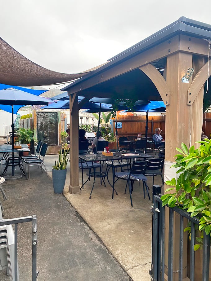 Outdoor seating with California casual vibes. Where breakfast meets fresh air under the gentle protection of umbrellas and wooden beams.