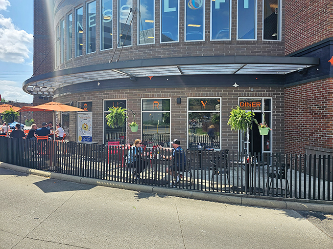 Summer unlocks Mercury's outdoor seating area—a fenced patio where pancakes taste even better under actual sky rather than painted planets.
