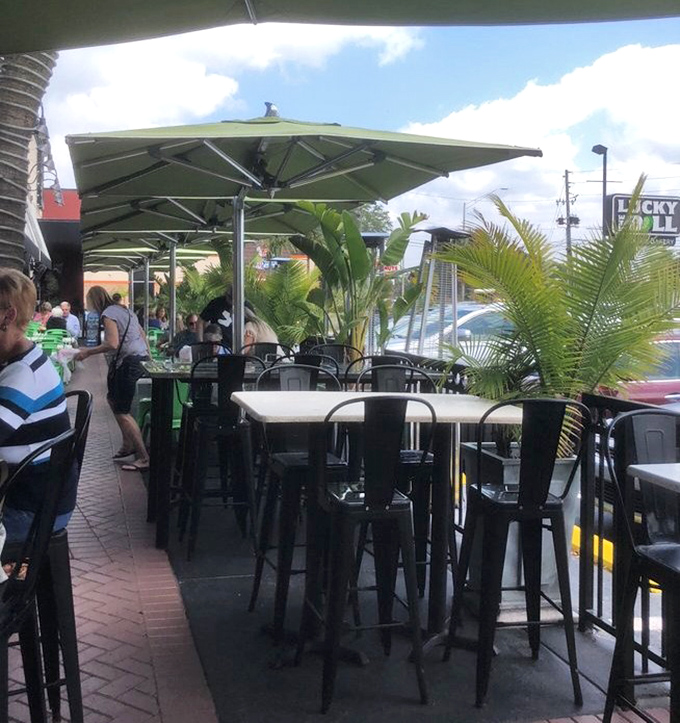 Florida sunshine meets New York flavor on this outdoor patio. Palm trees and pastrami—a combination that somehow makes perfect sense.